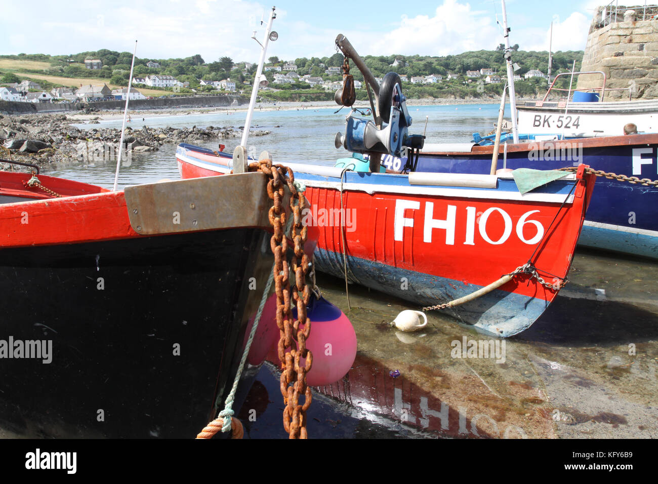 Fishing boats at low tide, Coverack Cove, Cornwall, England Stock Photo ...