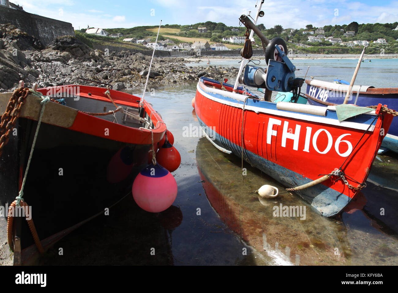 Fishing boats at low tide, Coverack Cove, Cornwall, England Stock Photo ...