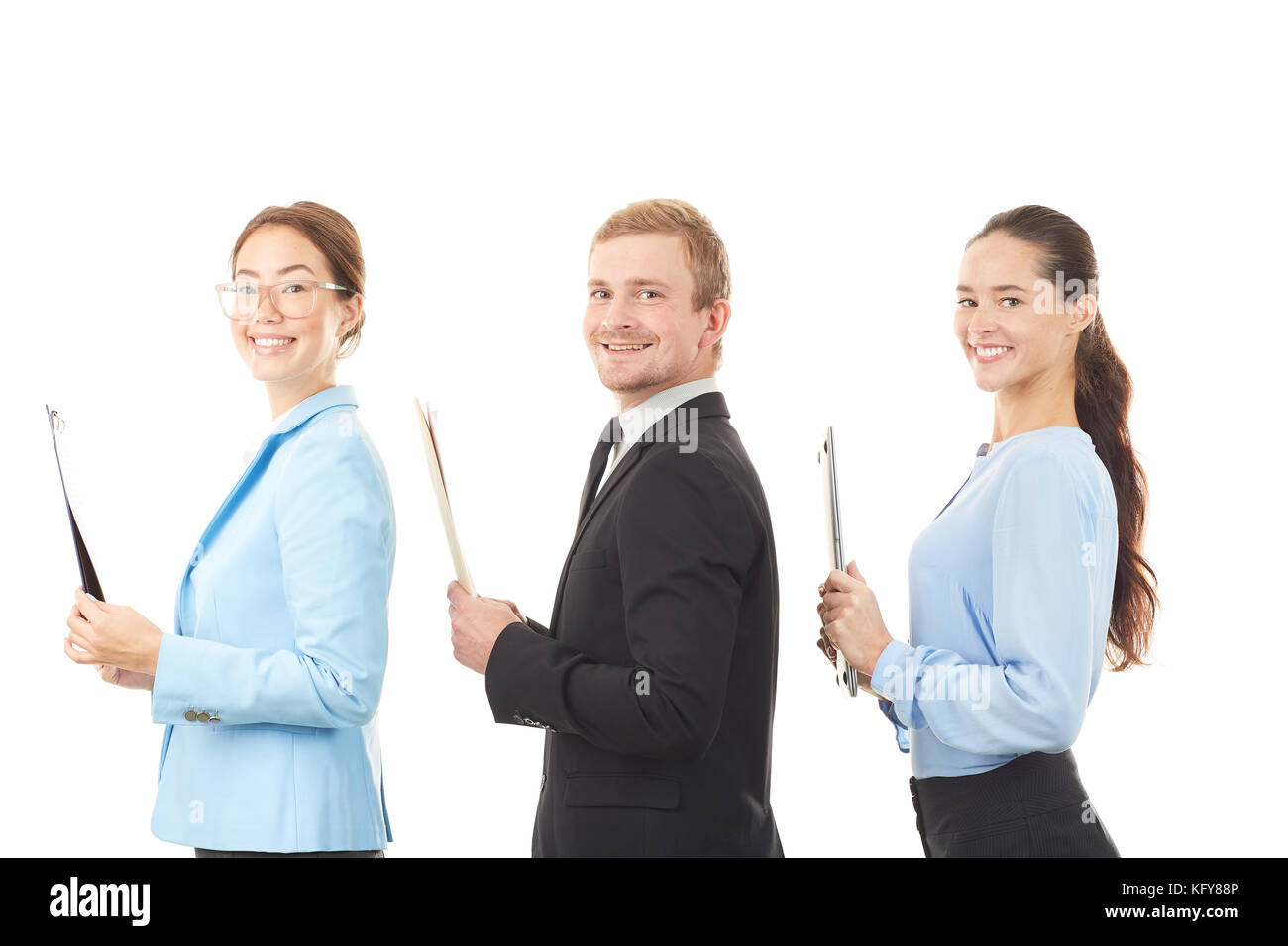 Portrait of three office workers standing one after another on white ...
