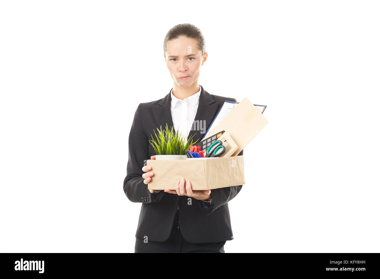 Portrait of female employee holding box with belongings Stock Photo - Alamy