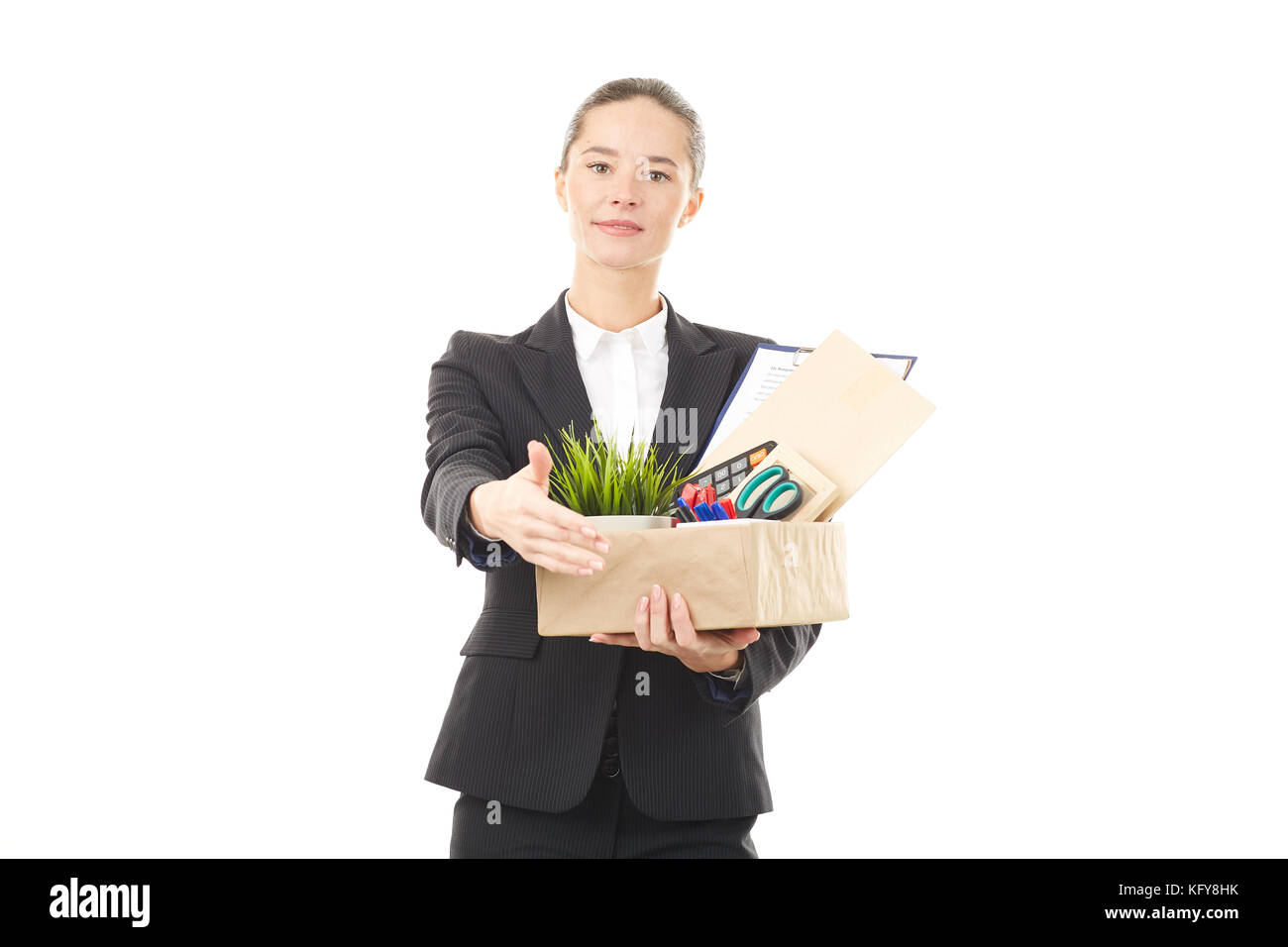 Portrait of female employee holding box with belongings Stock Photo - Alamy