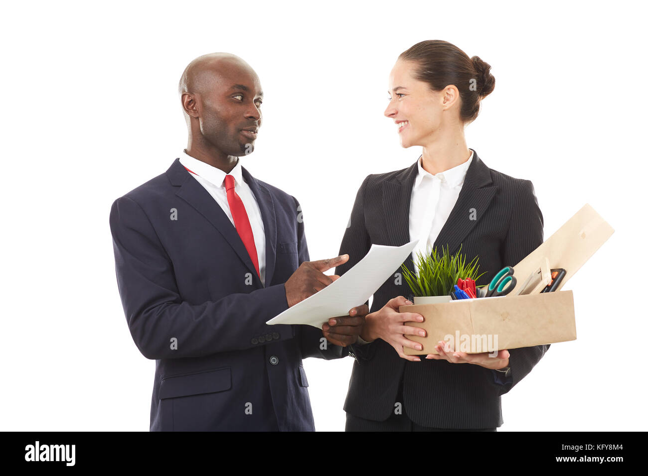 Portrait of male employer and female employee holding box with personal ...