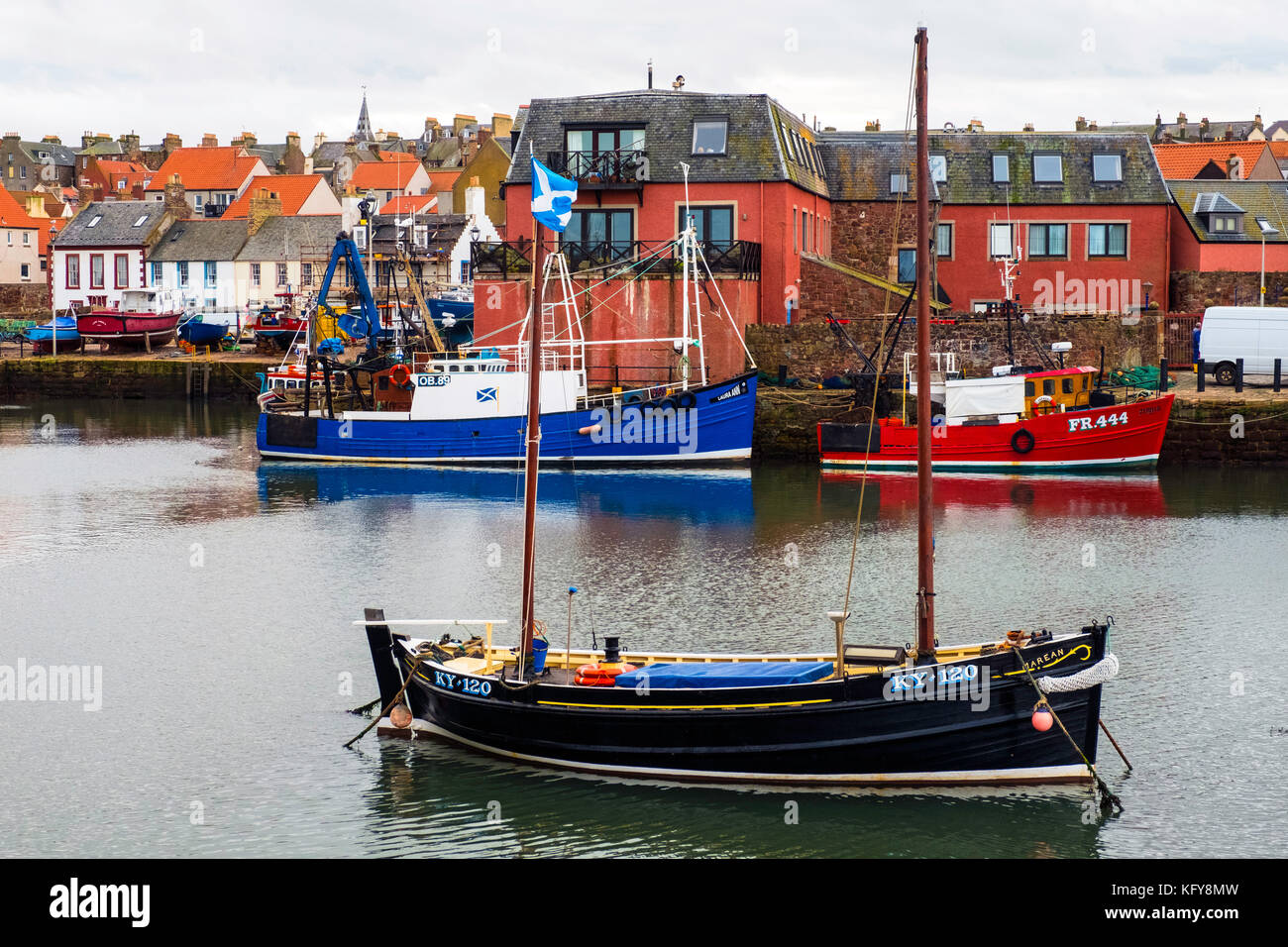 View of fishing boats in harbour at Dunbar on East coast of Scotland ...