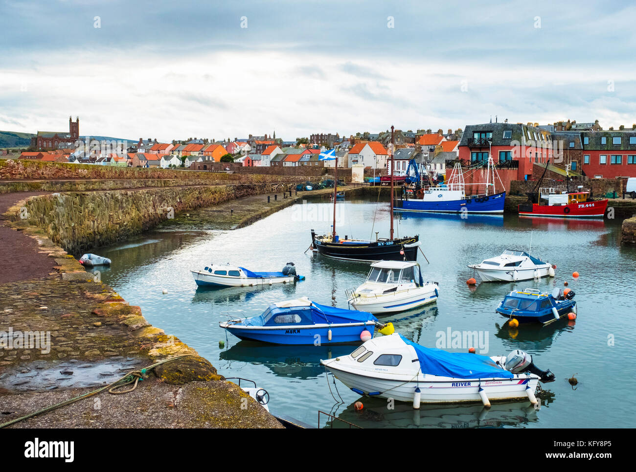 View of fishing boats in harbour at Dunbar on East coast of Scotland ...