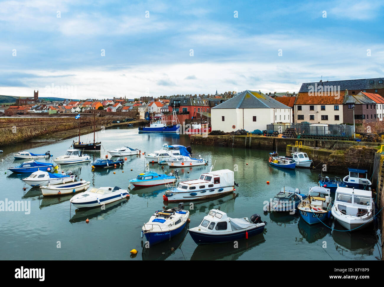 View of fishing boats in harbour at Dunbar on East coast of Scotland ...