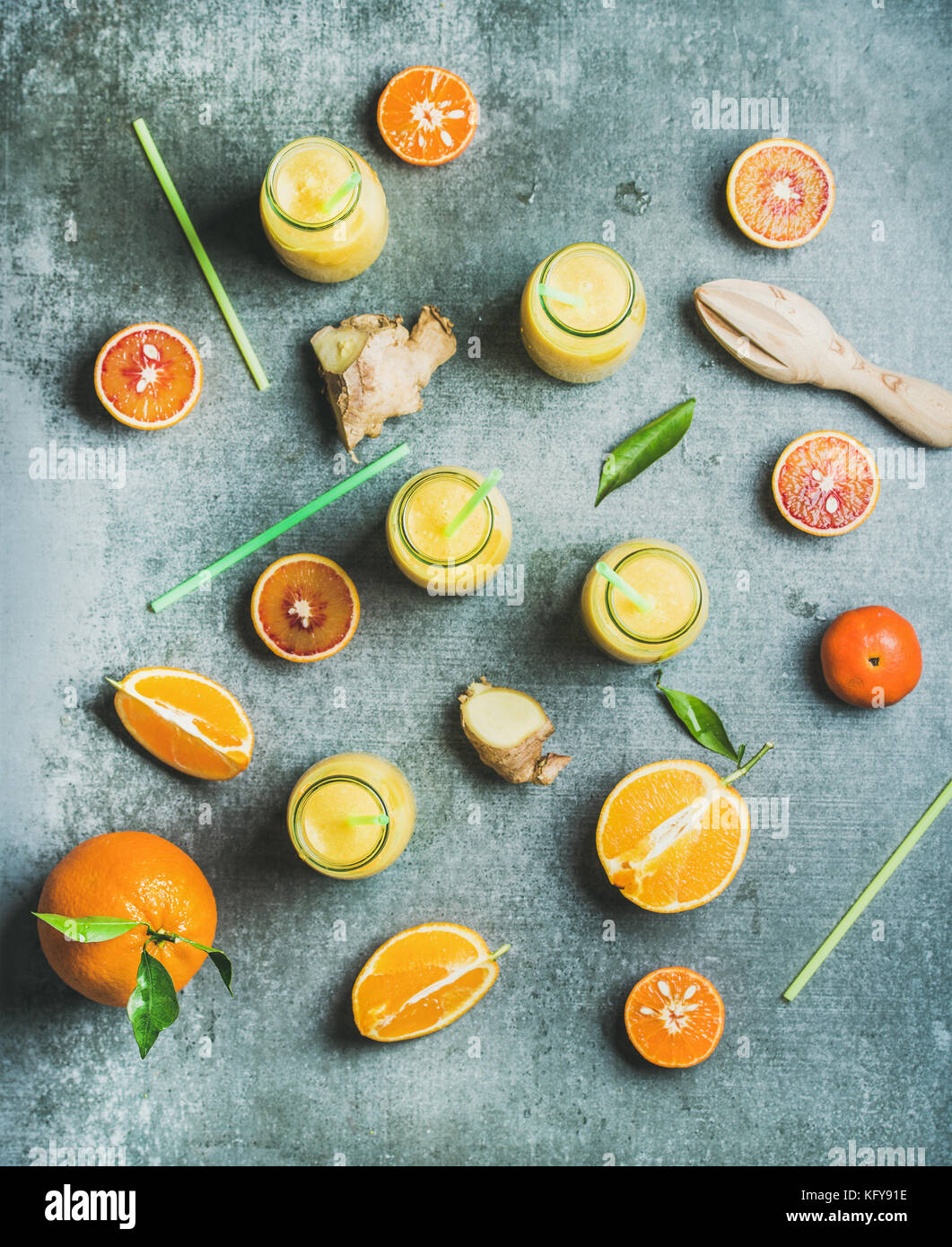 Healthy yellow smoothie with ginger over grey background Stock Photo ...