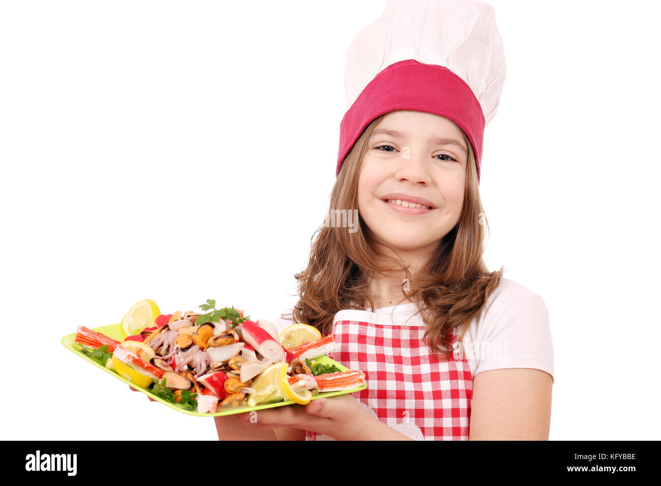 happy little girl cook with seafood Stock Photo - Alamy