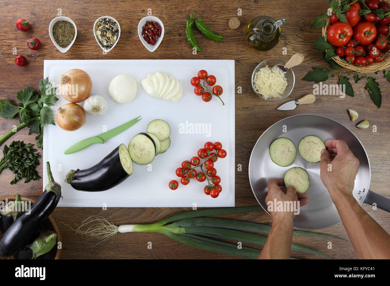 food top view, hands cut and cook eggplants in kitchen wooden topwork ...