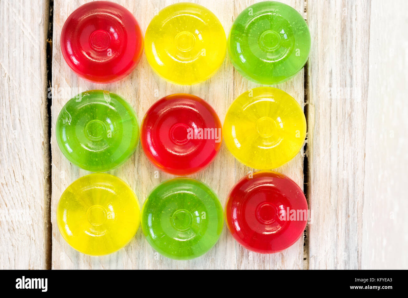 Multicolored square of sugar candies. Three rows and three columns ...