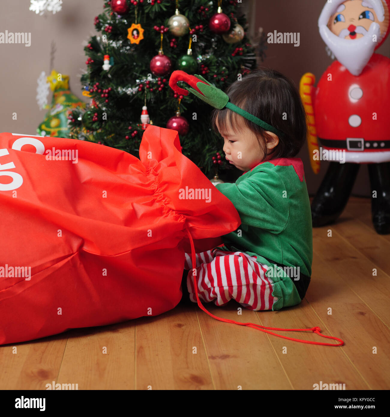 baby girl gets her christmas gift Stock Photo - Alamy