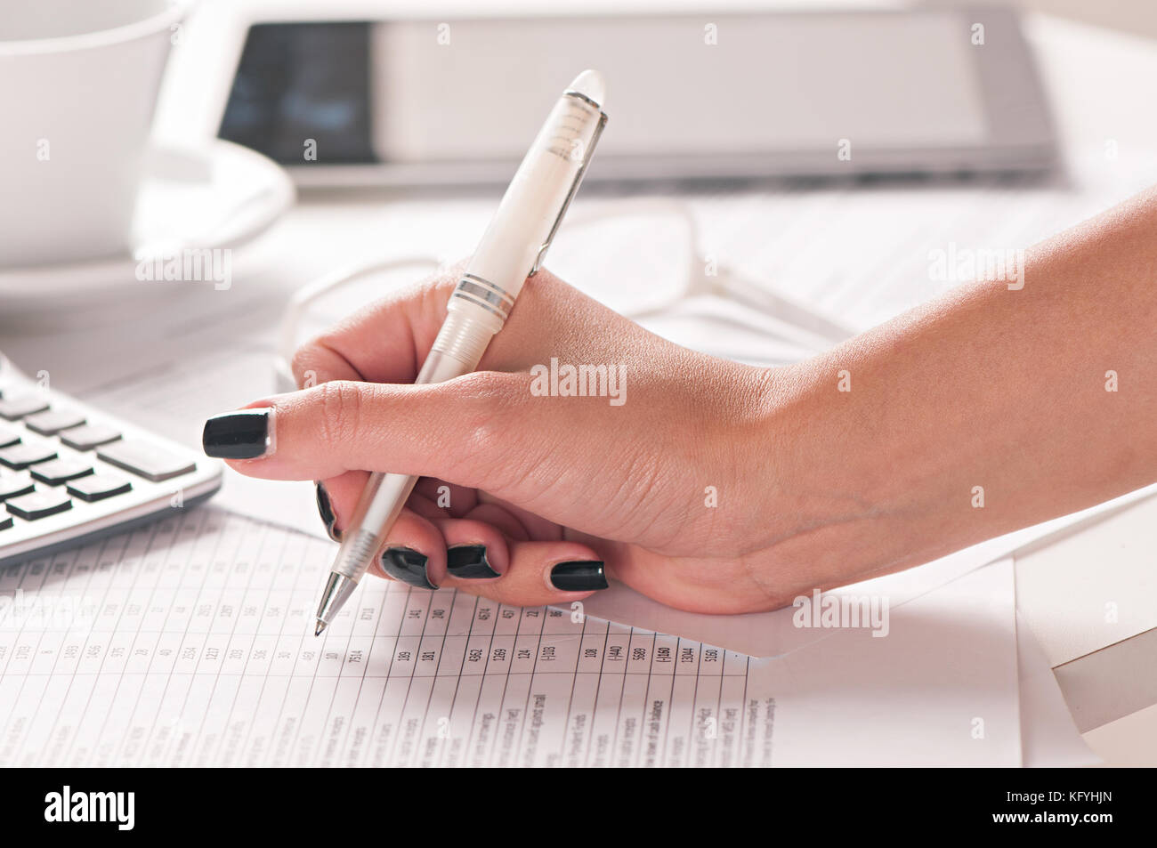 Close up hand woman making accounting Stock Photo - Alamy