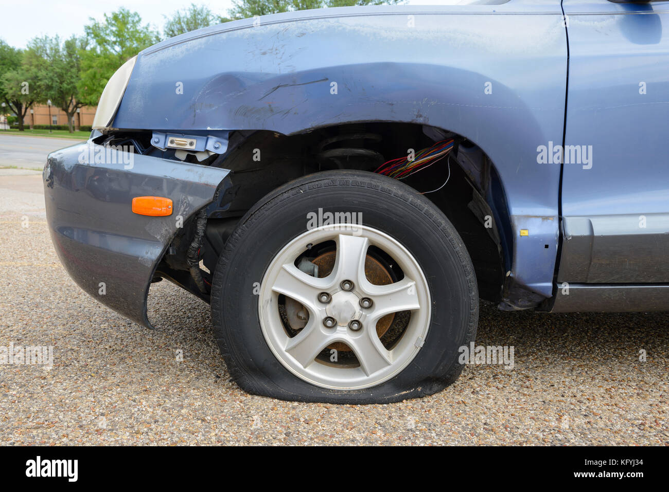 Car accident, flat tire, broken bumper. Old car Stock Photo - Alamy