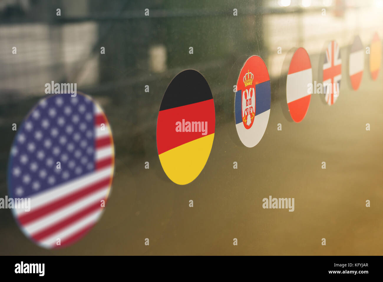 Flag stickers labels on store front window Stock Photo - Alamy
