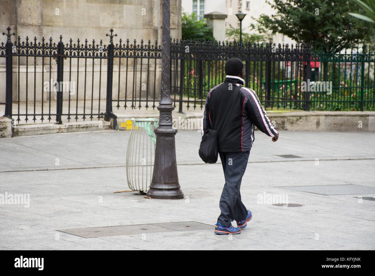 African-French people walking at Courtyard of Church of Saint-Laurent ...