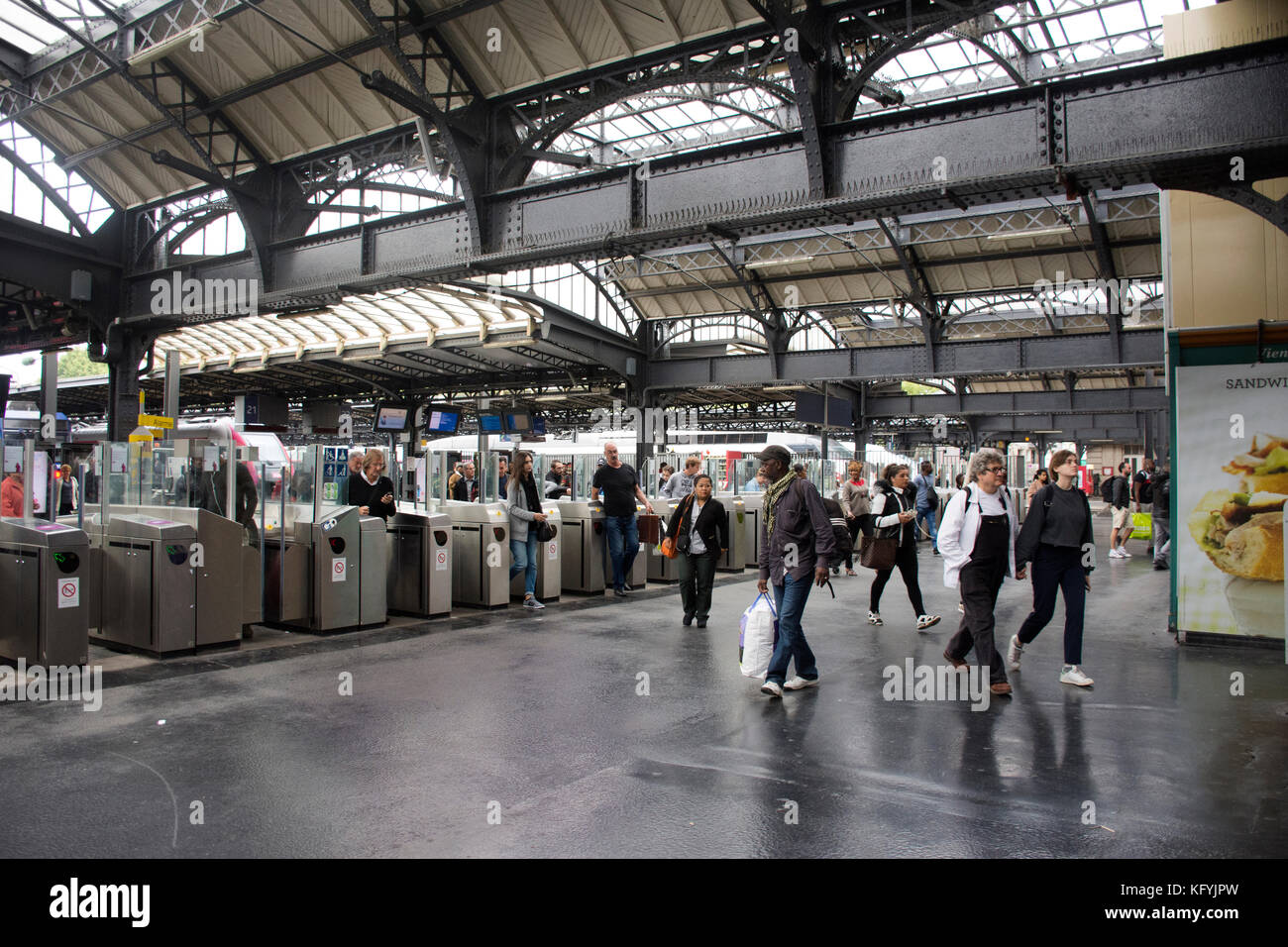 French people and foreigner travlers walk and wait train at Gare de ...