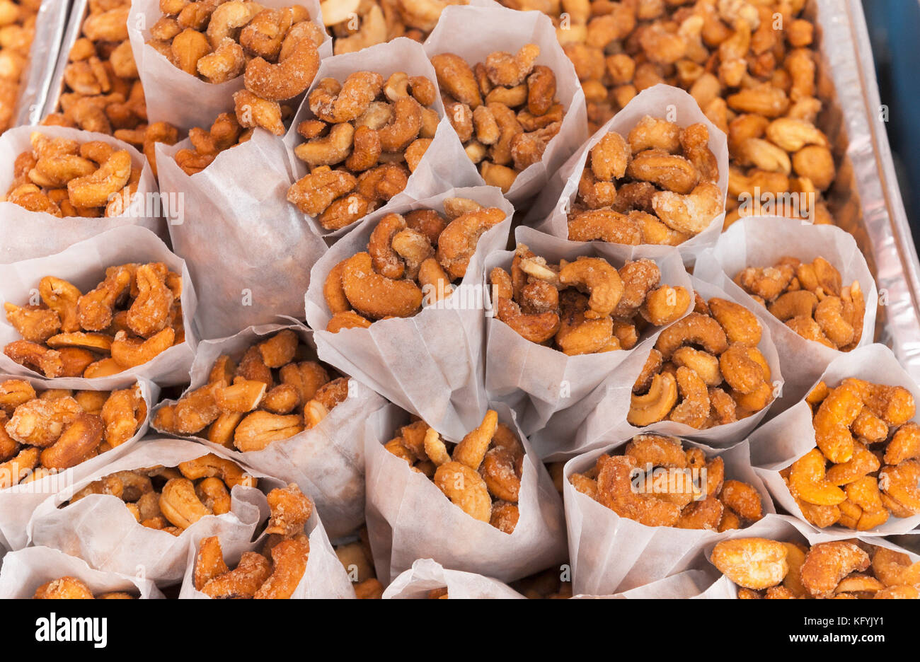Salted peanuts in small packages Stock Photo - Alamy