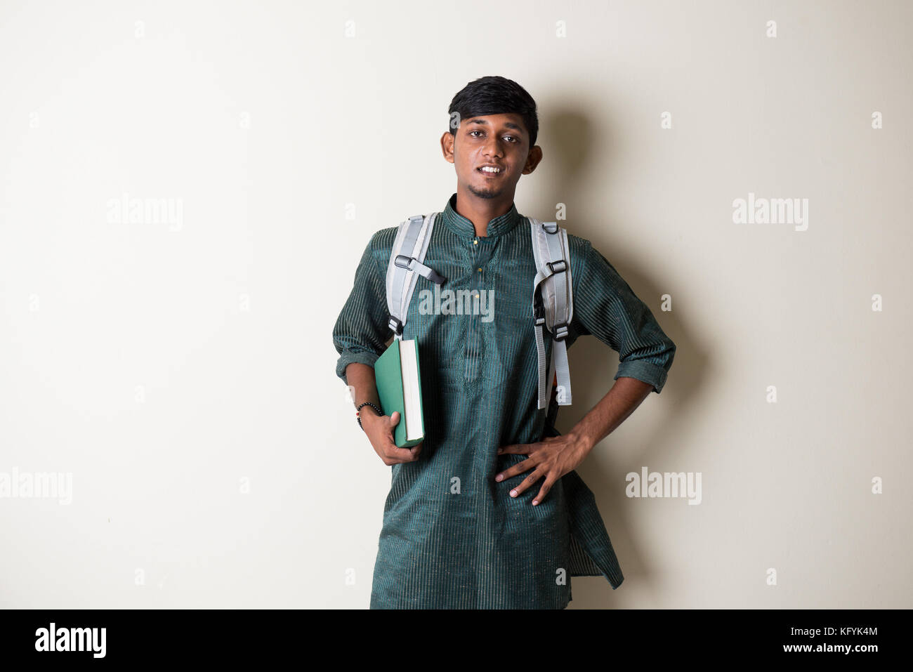 teenage indian male in traditional dress reading books Stock Photo - Alamy