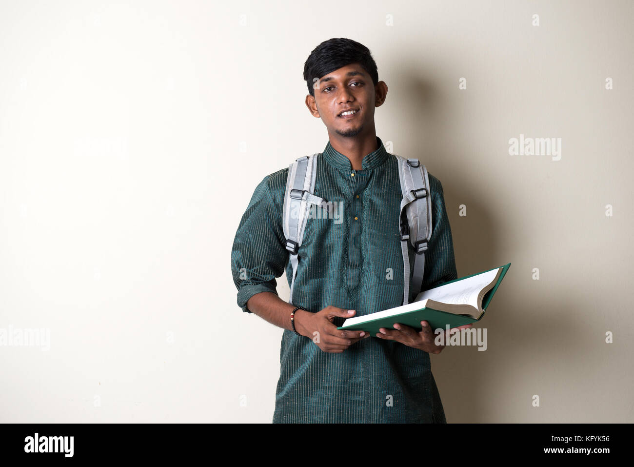 teenage indian male in traditional dress reading books Stock Photo - Alamy