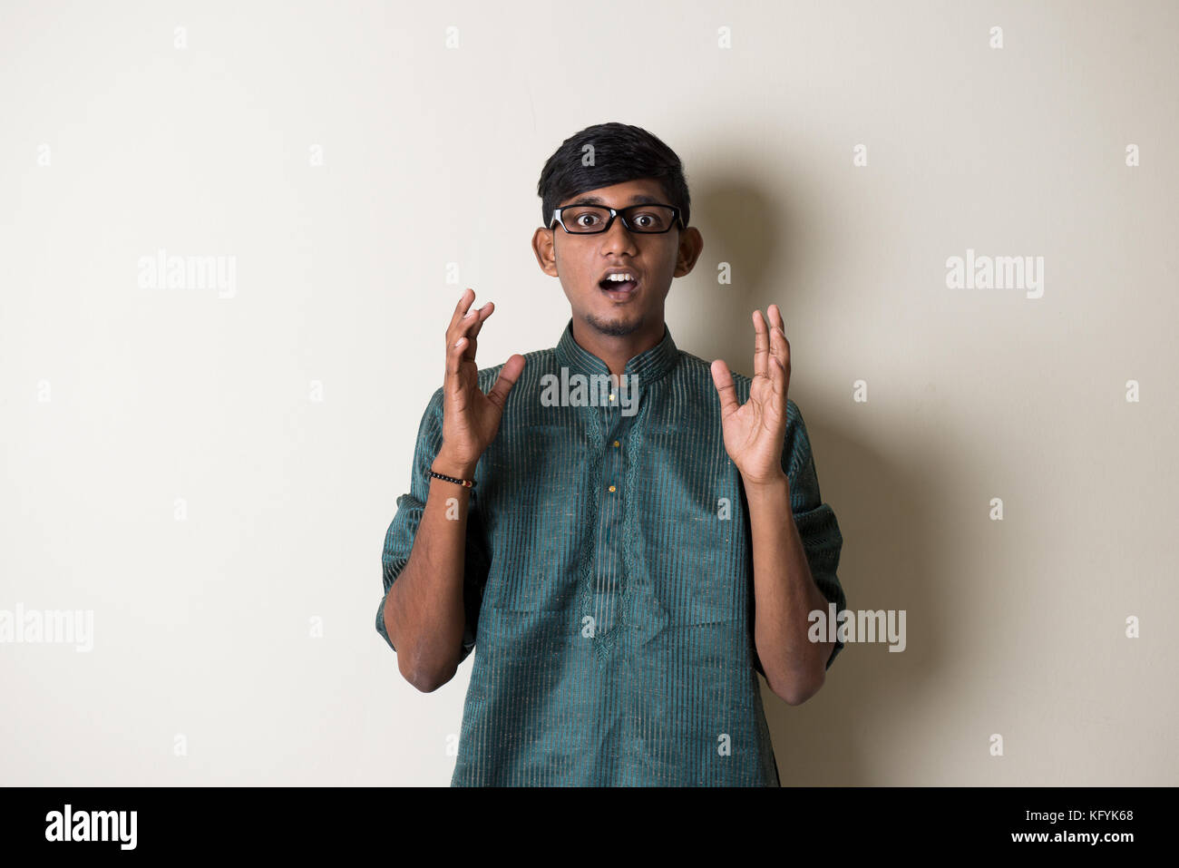 teenage indian male in traditional dress shouting Stock Photo - Alamy