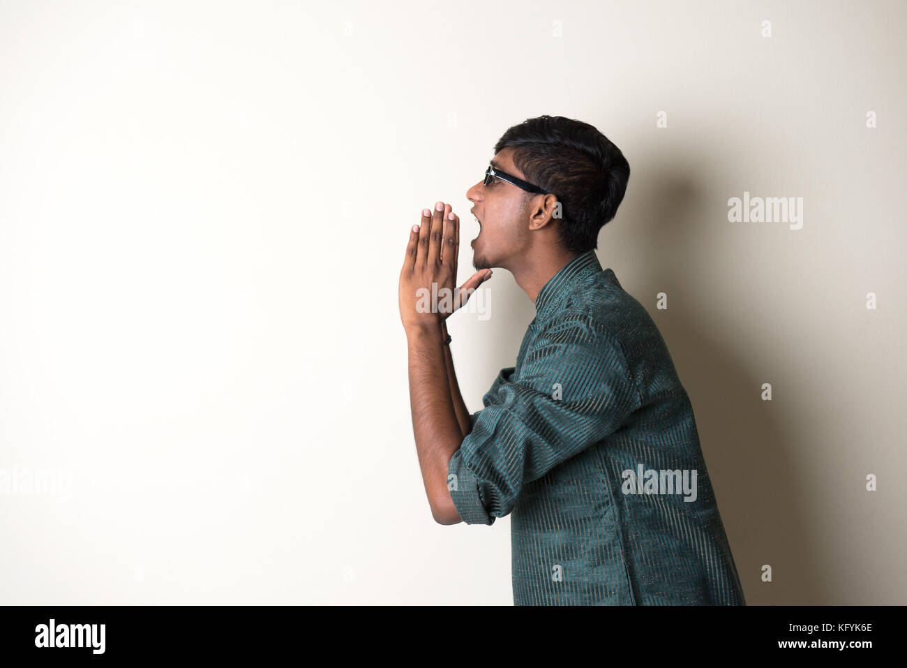 teenage indian male in traditional dress shouting Stock Photo - Alamy