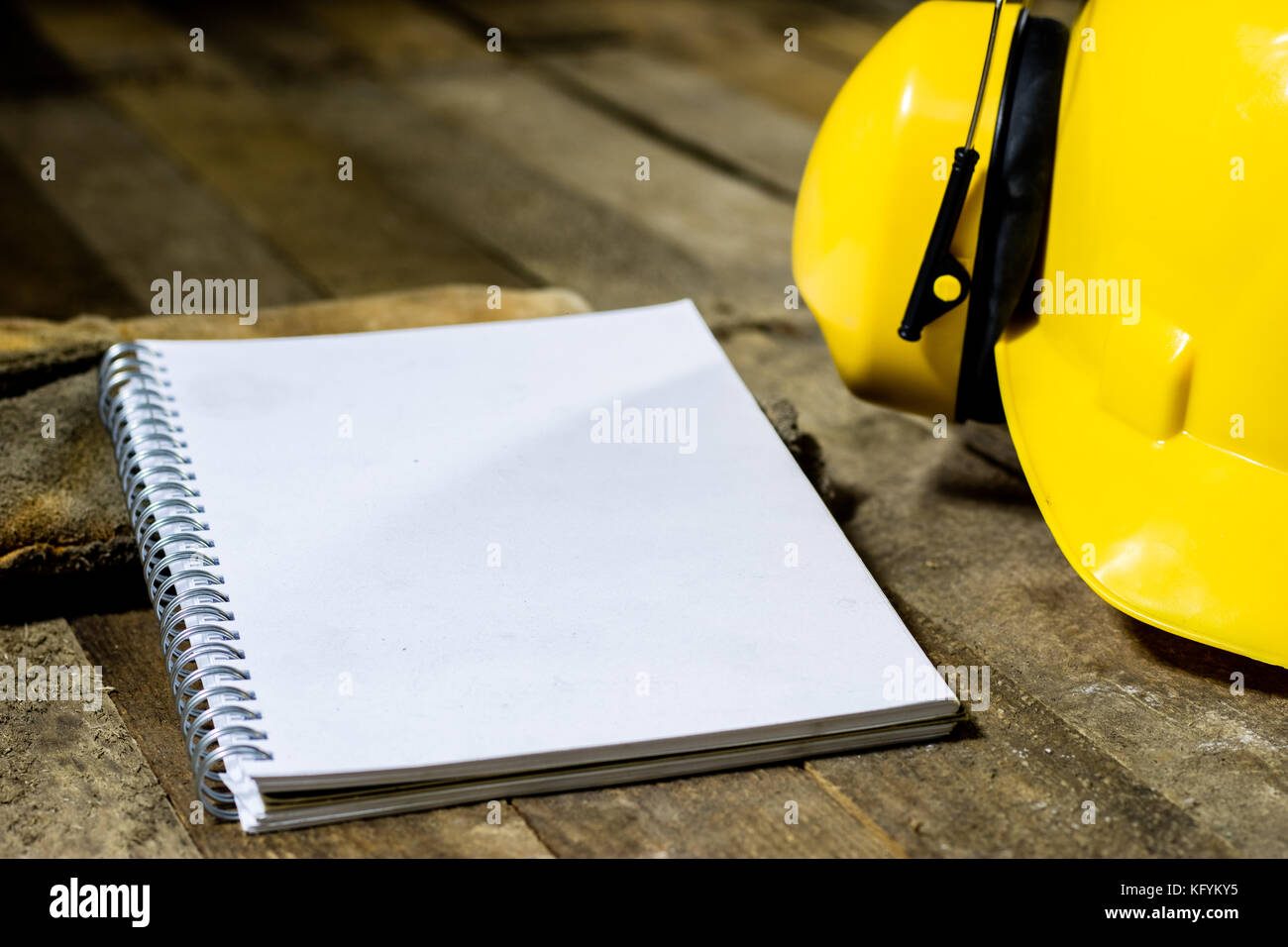 helmet, hearing protection, tools, workshop table. Safety equipment and ...