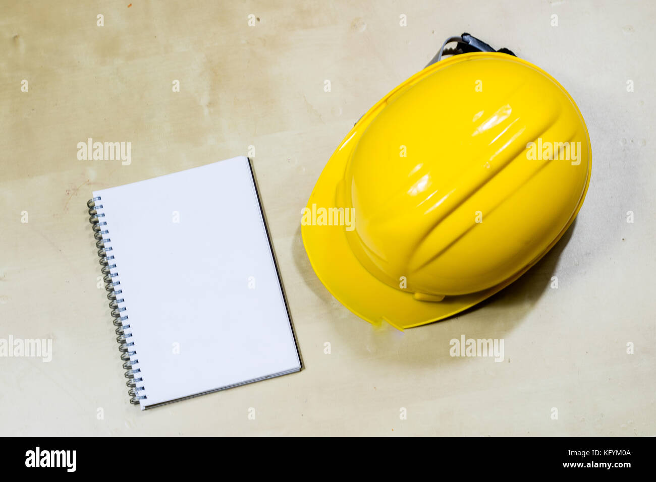 helmet, hearing protection, tools, workshop table. Safety equipment and ...