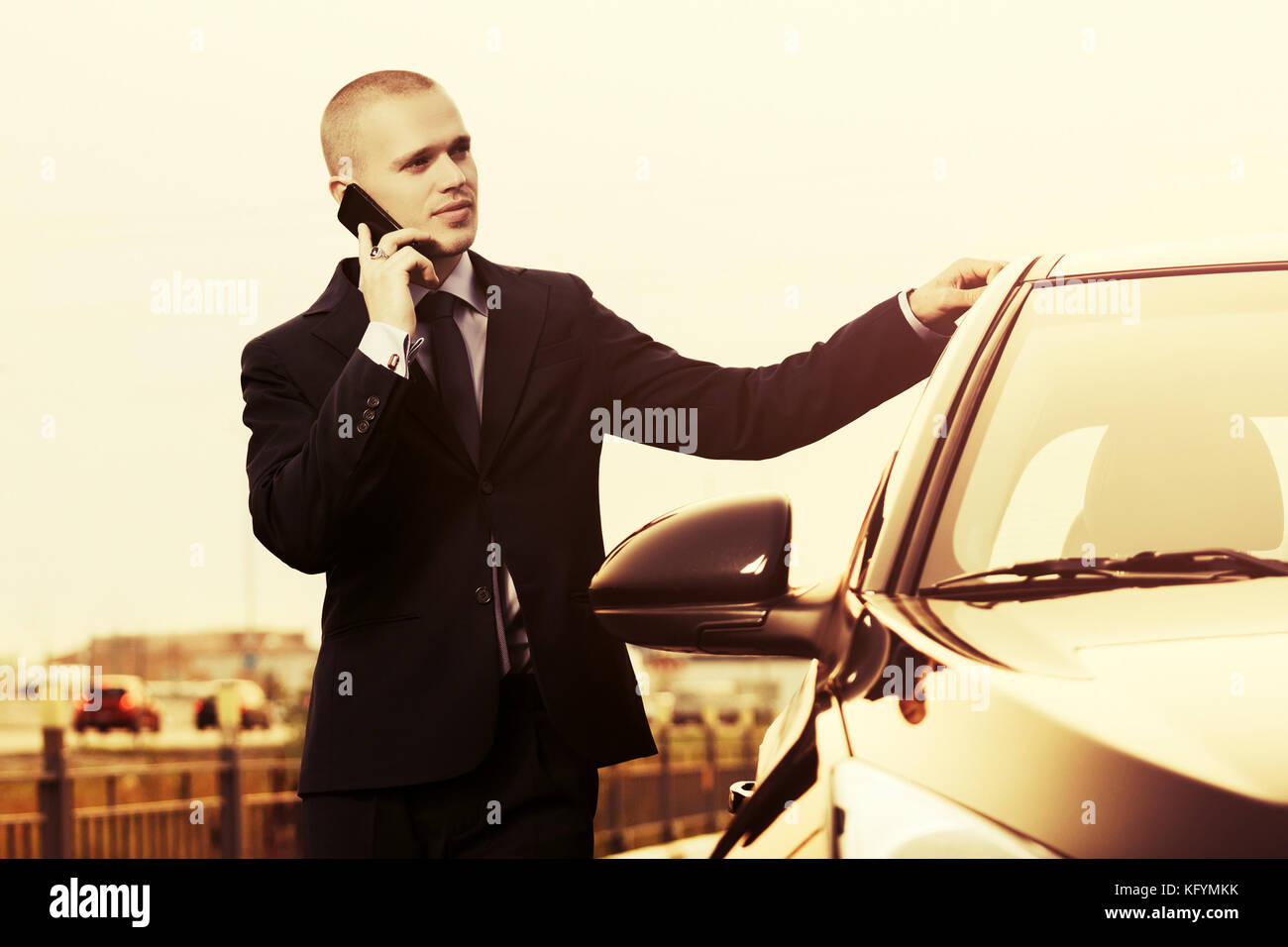 Young handsome businessman calling on cell phone next to his car Stock ...