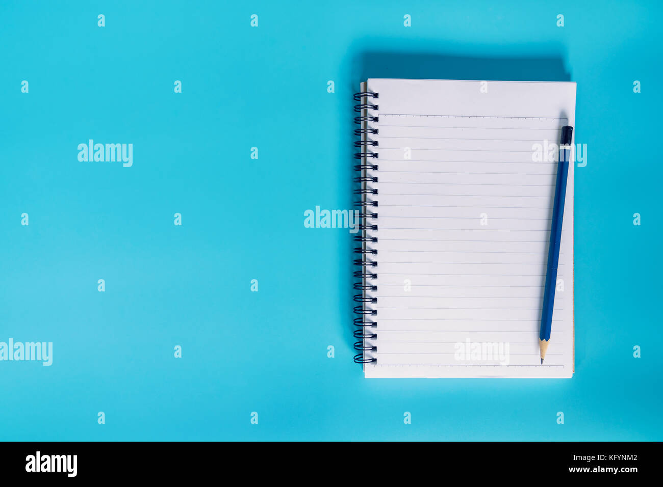 top view notebook paper on blue pastel color background with space ...