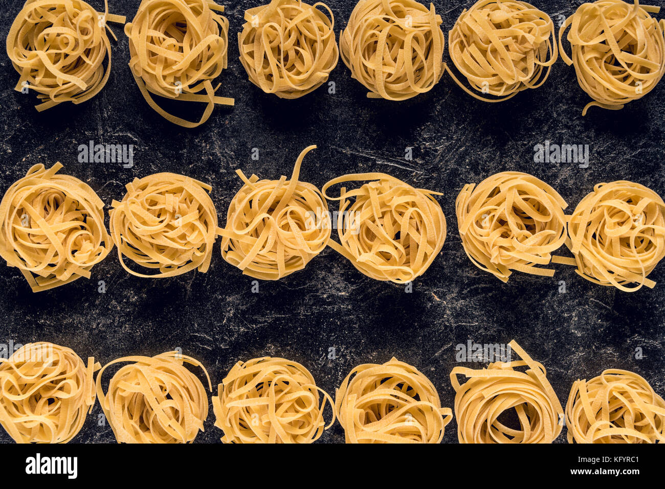 pasta nests in rows Stock Photo - Alamy