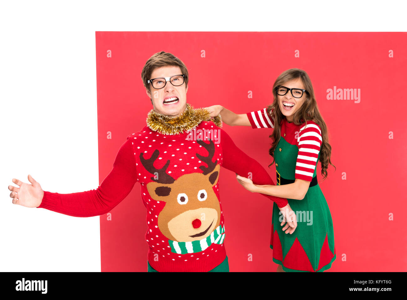 couple in christmas costumes having fun Stock Photo - Alamy