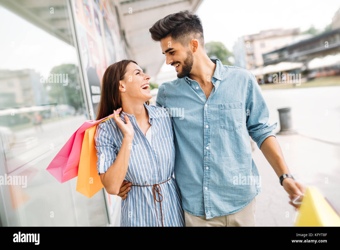 Happy attractive loving couple enjoy shopping together Stock Photo - Alamy
