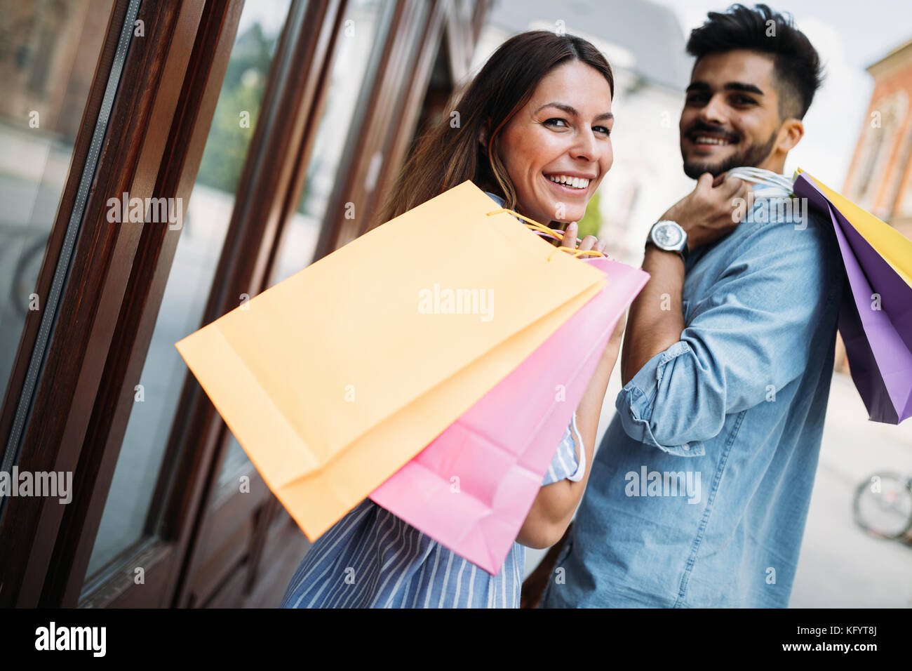 Happy attractive loving couple enjoy shopping together Stock Photo - Alamy