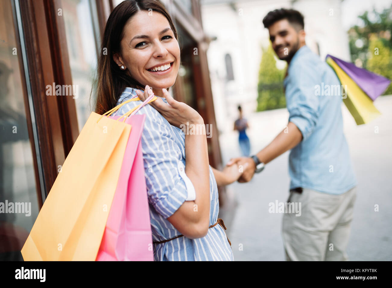 Happy attractive loving couple enjoy shopping together Stock Photo - Alamy