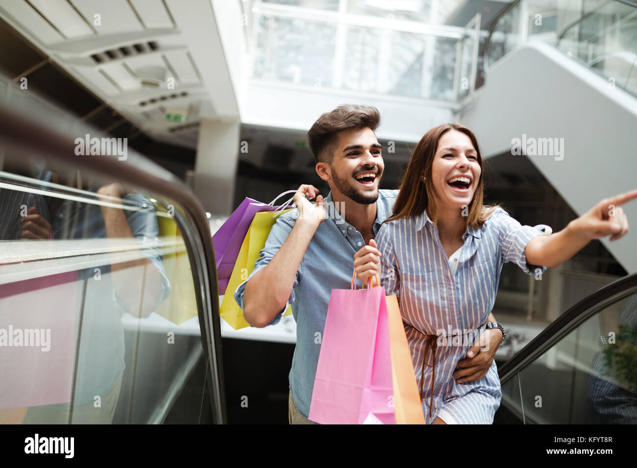 Happy attractive loving couple enjoy shopping together Stock Photo - Alamy
