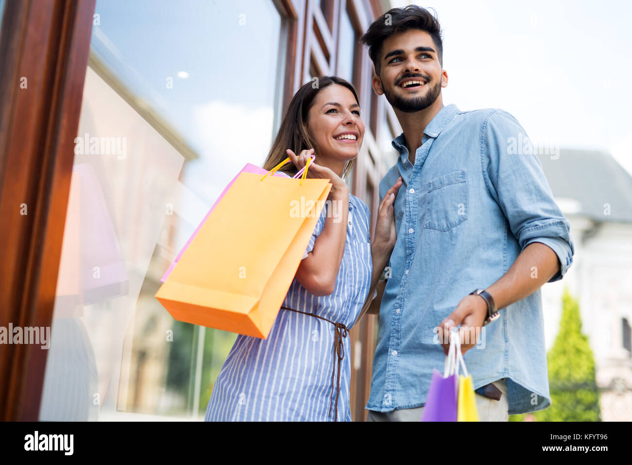 Happy attractive loving couple enjoy shopping together Stock Photo - Alamy