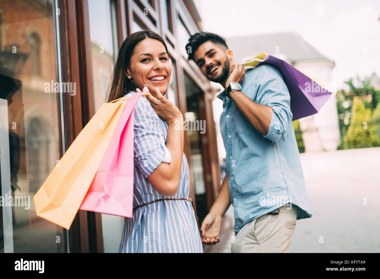 Happy attractive loving couple enjoy shopping together Stock Photo - Alamy
