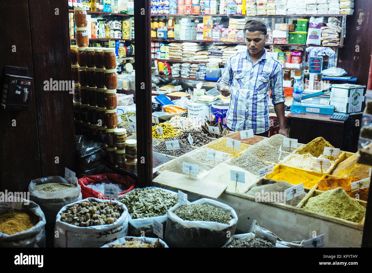 Doha, Qatar - November 20, 2013. A local salesman is selling different ...