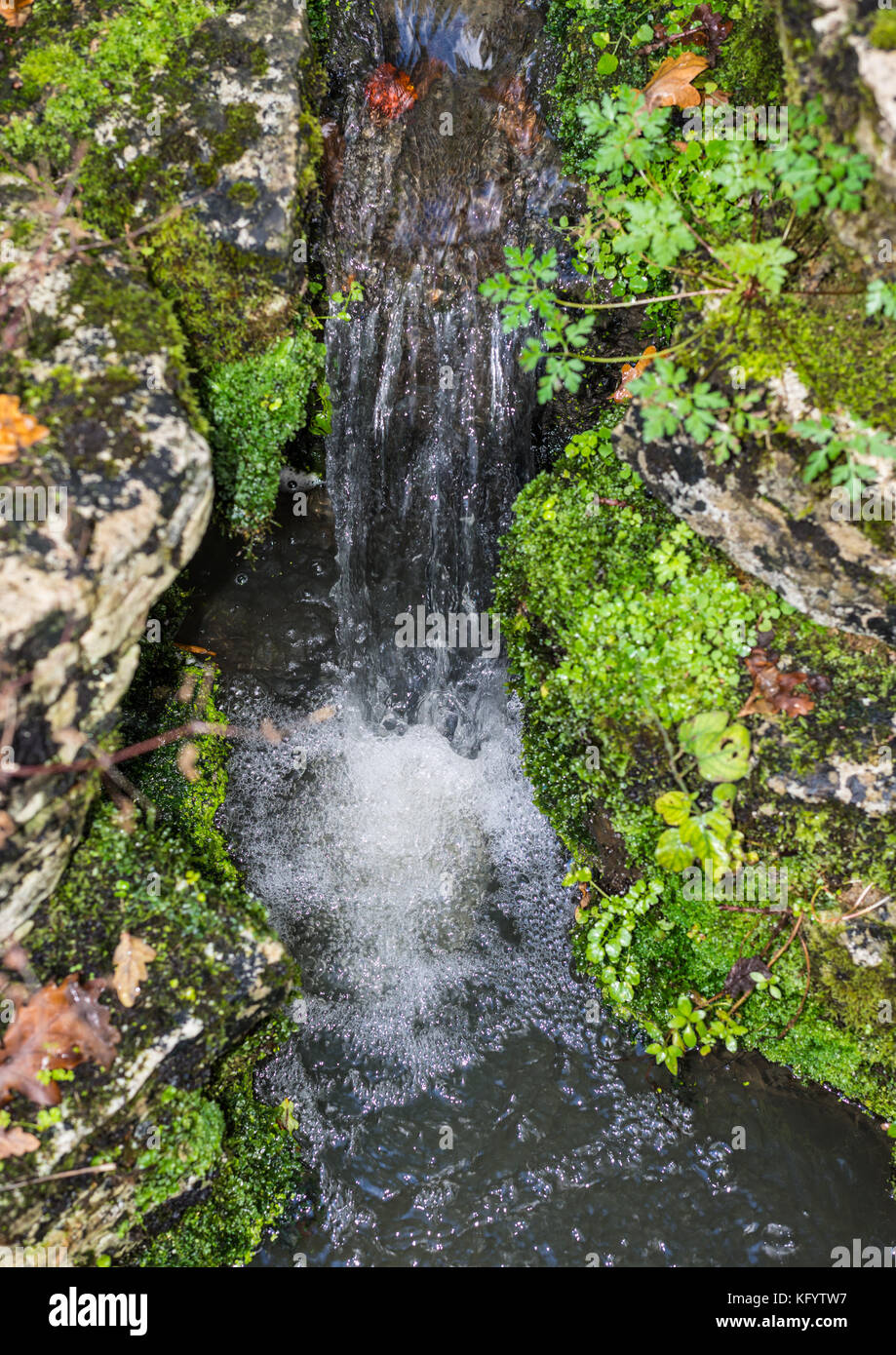 A close-up shot of a small waterfall Stock Photo - Alamy