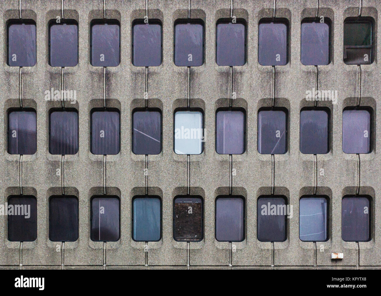 An array of windows in a city centre building Stock Photo - Alamy