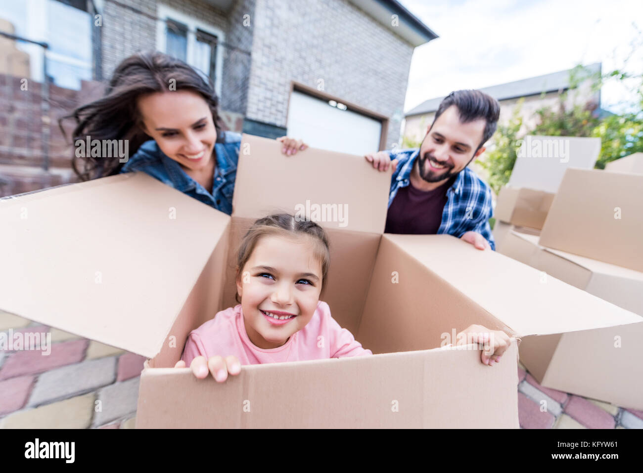 girl sitting in cardboard box Stock Photo - Alamy
