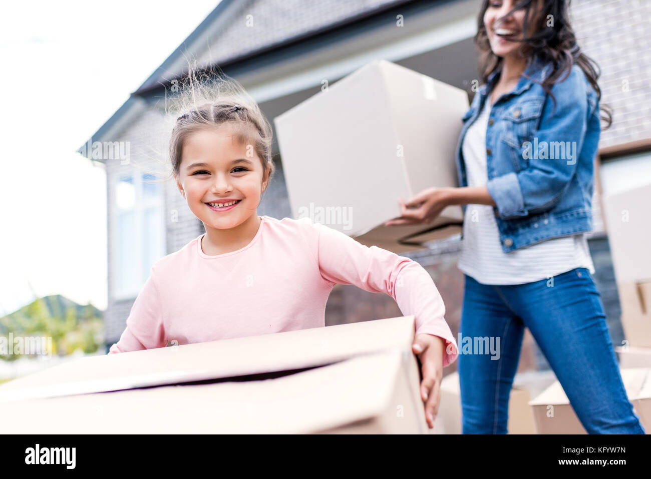 mother and daughter moving into new house Stock Photo - Alamy