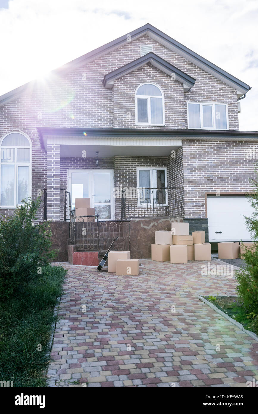 house with stacks of cardboard boxes Stock Photo - Alamy