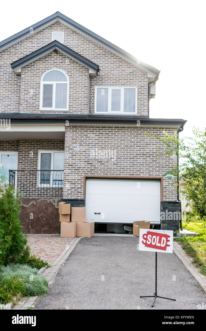 house with signboard sold Stock Photo - Alamy