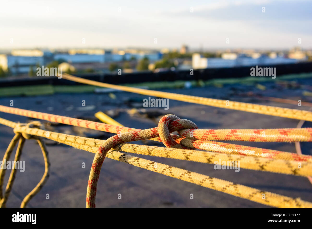 Closeup stretched and tied industrial braided rope Stock Photo - Alamy