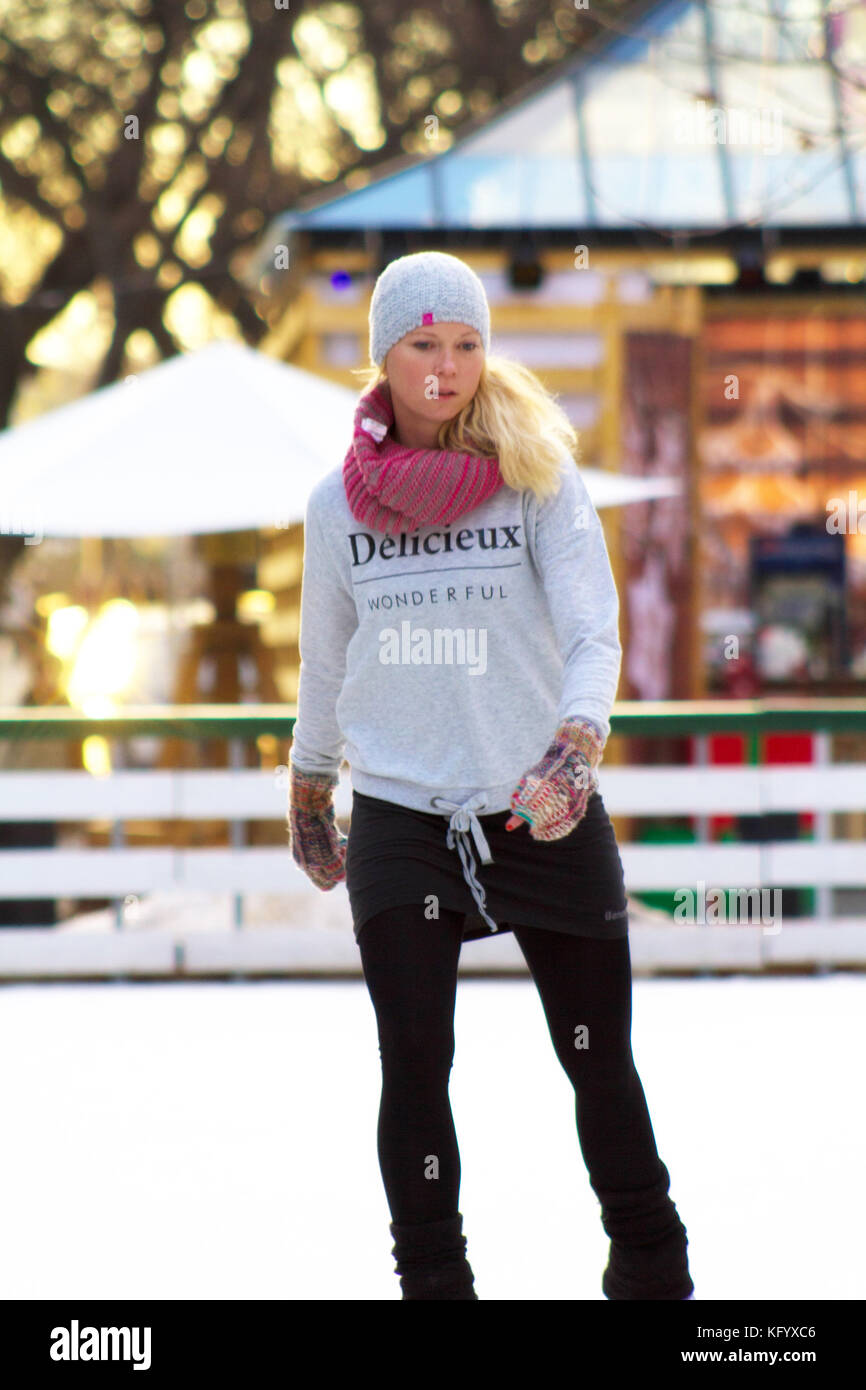 A young woman skating on ice-rink outdoor Stock Photo - Alamy