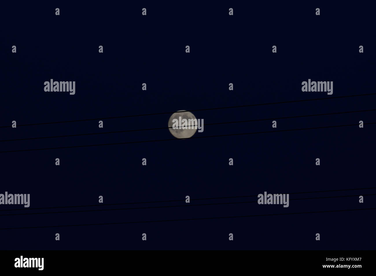 full moon between electric wires Stock Photo - Alamy