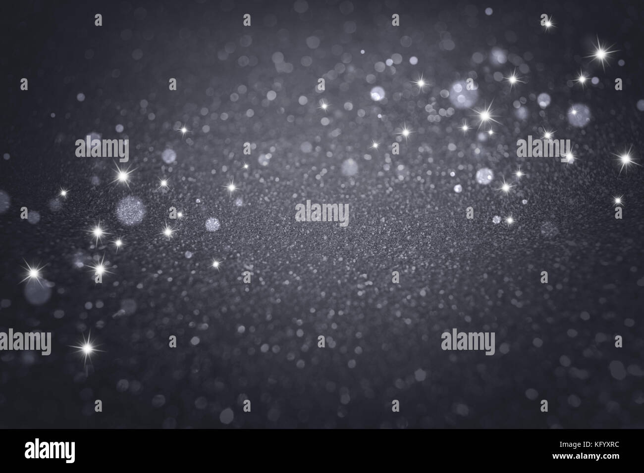 Bright stars on a glittering defocused black background Stock Photo - Alamy