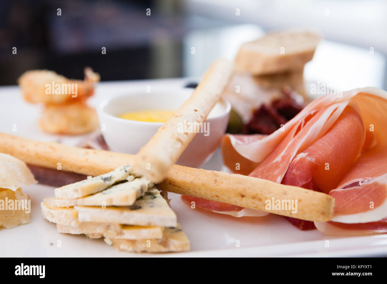 Tapas platter with variety of cheeses, ham and olives Stock Photo - Alamy