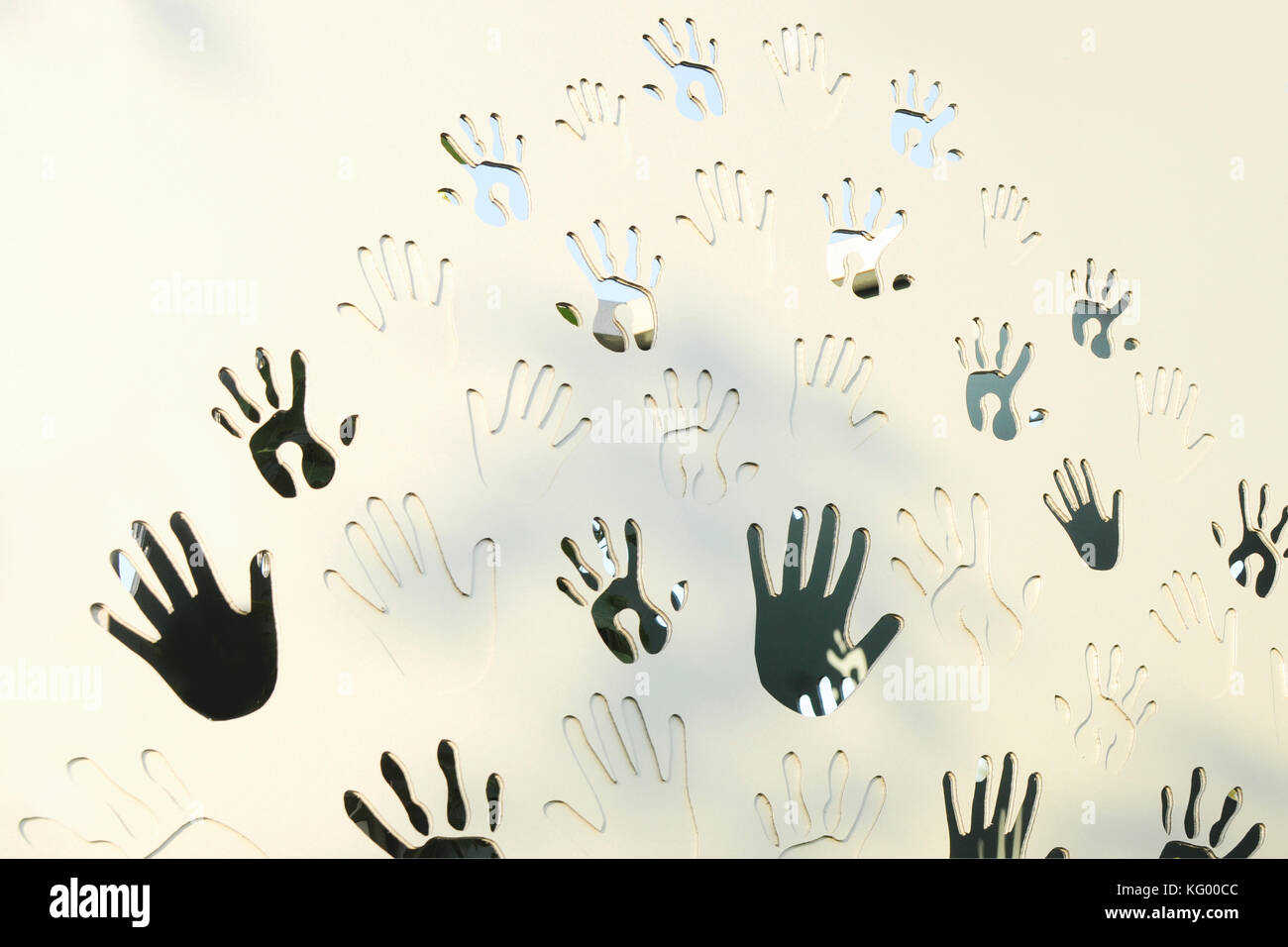 Handprints, adults and children's palms make a natural pattern on a ...