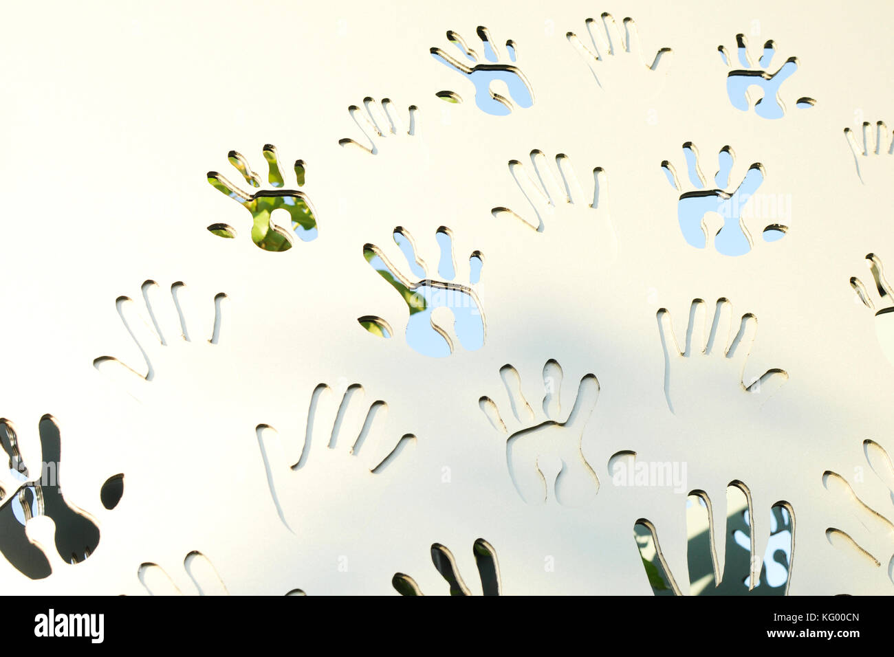 Handprints, adults and children's palms make a natural pattern on a ...